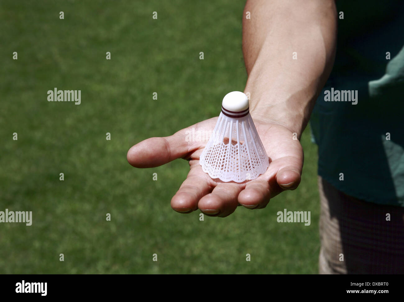Hand holding badminton ball Stock Photo - Alamy