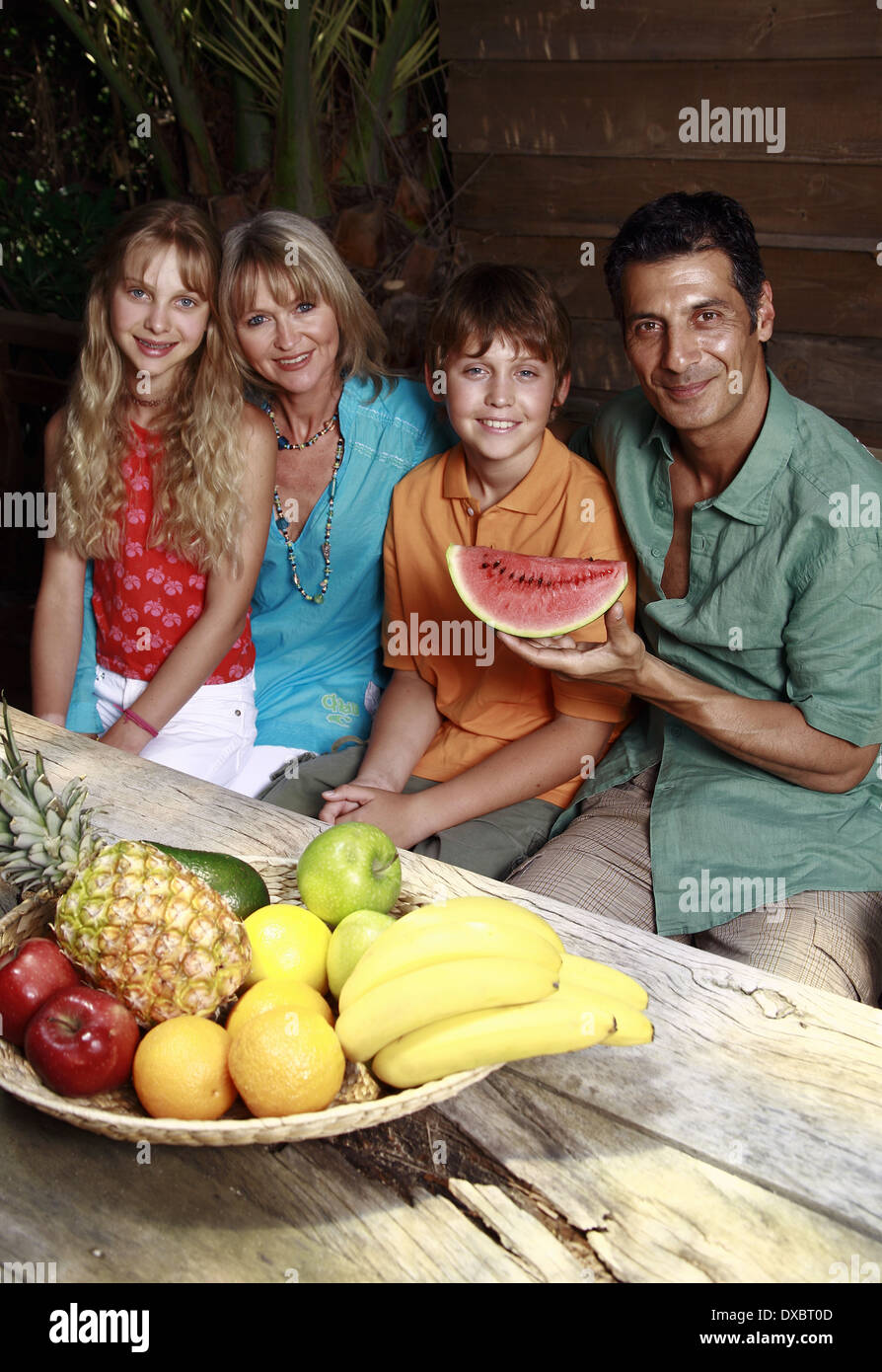 Parents with children and fruit Stock Photo - Alamy