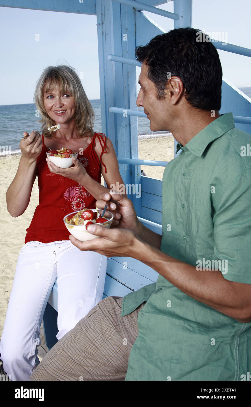 Middle aged woman eating yogurt hi-res stock photography and images - Alamy