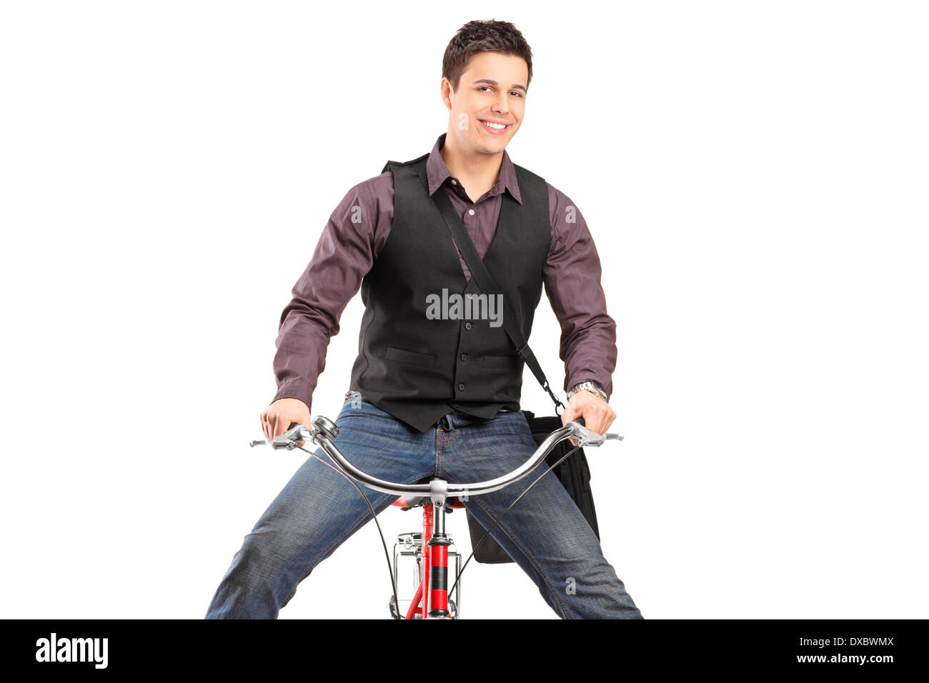 Young happy man riding a bike Stock Photo - Alamy