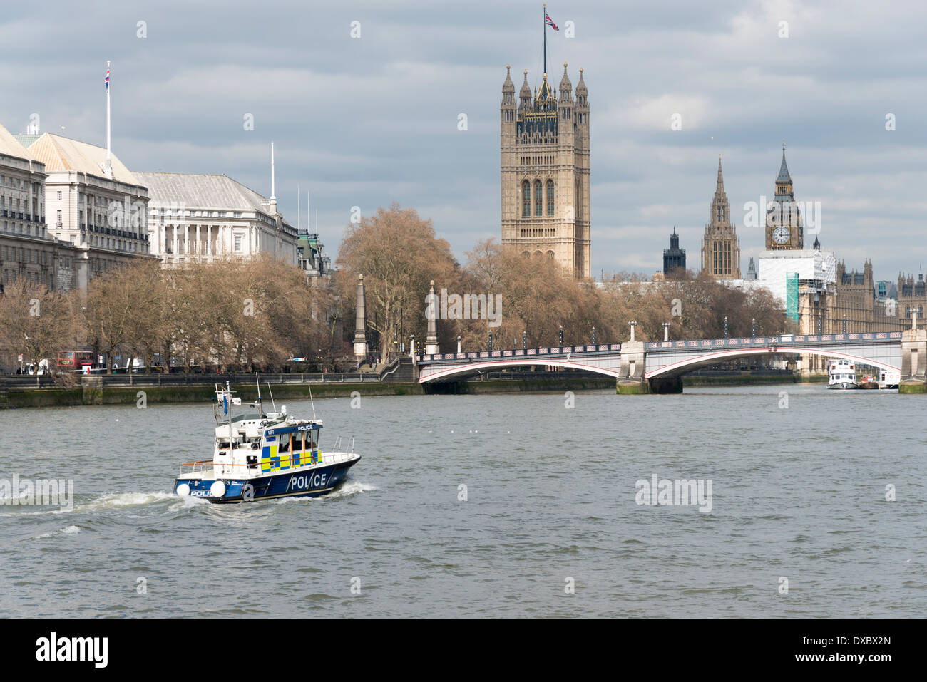 A police launch or boat on patrol on the River Thames at Westminster ...