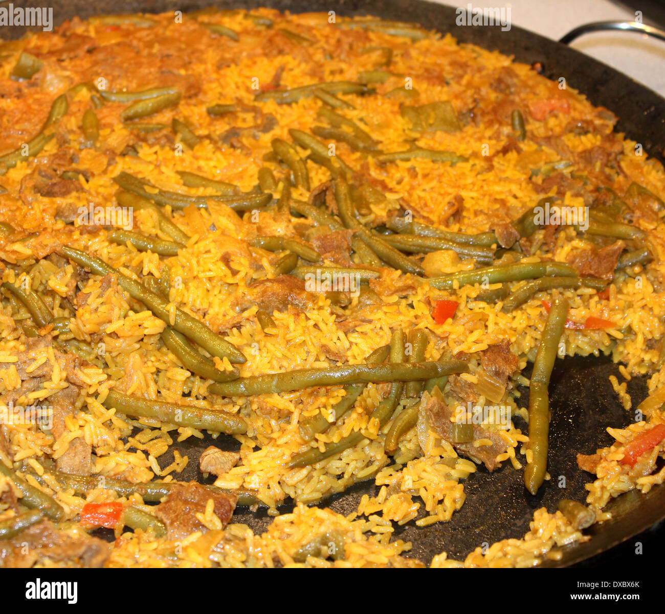 Cooking paella typical from Valencia Spain recipe with rice beans ...