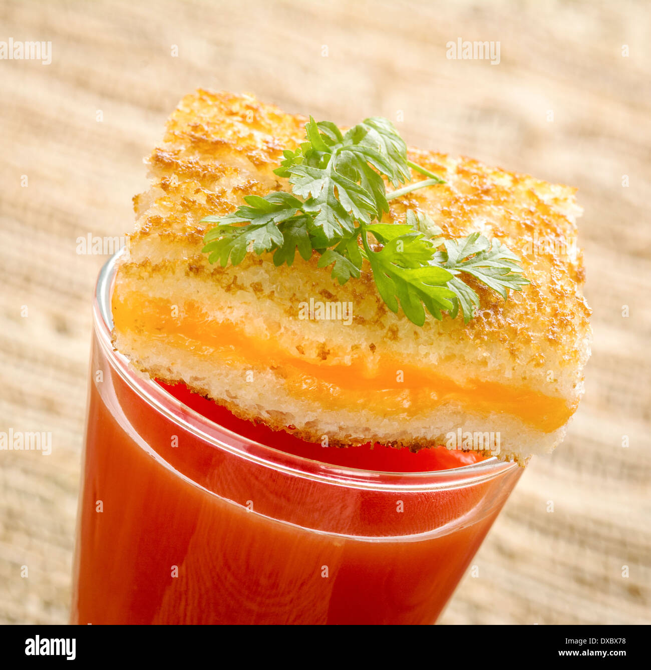 Tomato soup shooter with mini grilled cheese appetizer Stock Photo - Alamy