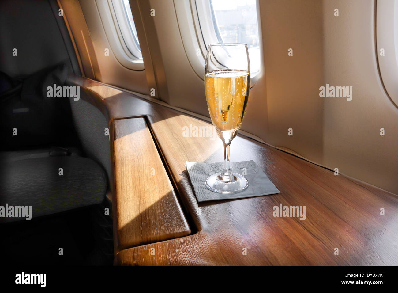A glass of welcoming Champagne awaits a First Class passenger on an ...