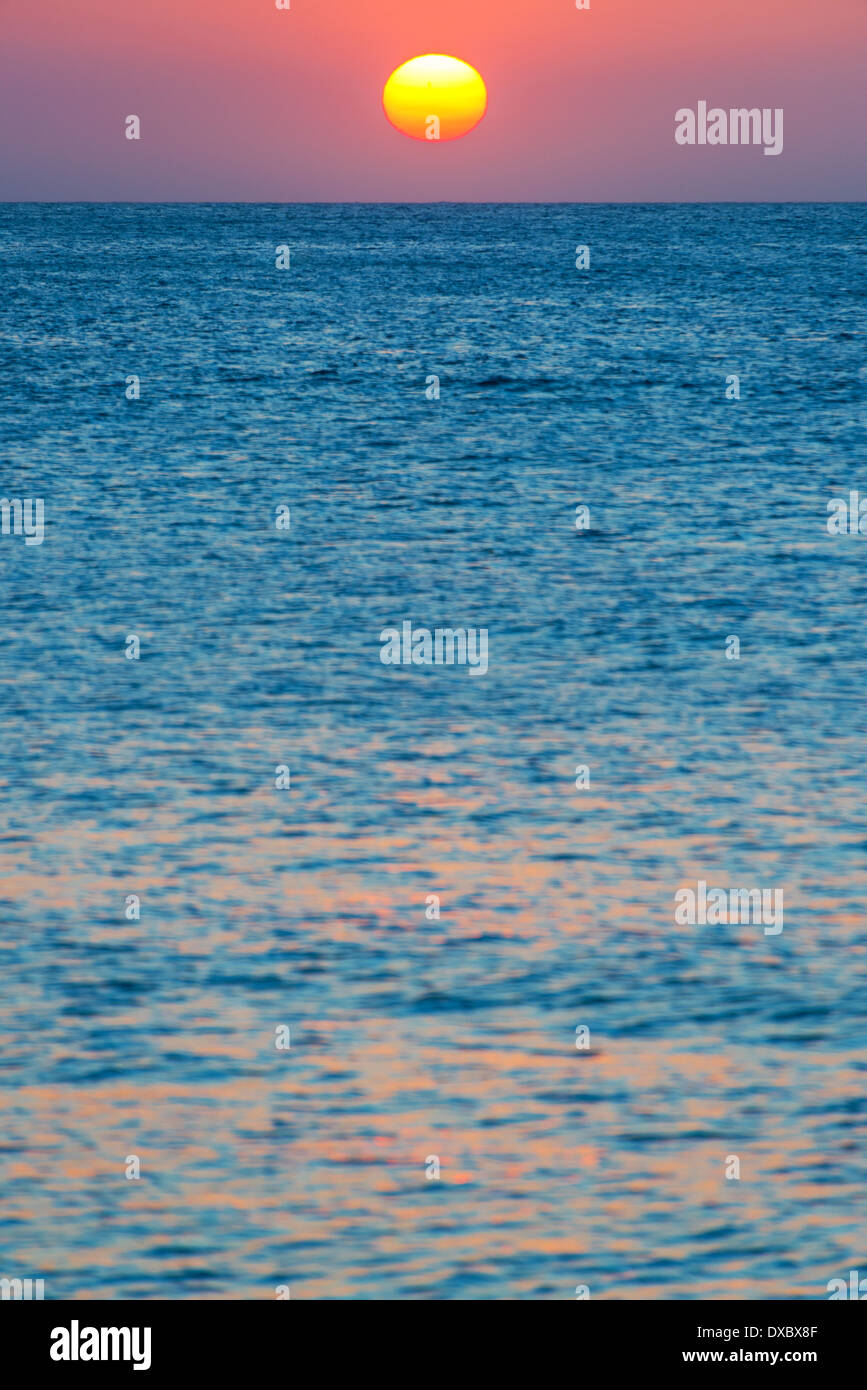Sun setting over the Caribbean Sea in Santa Marta, Colombia Stock Photo ...