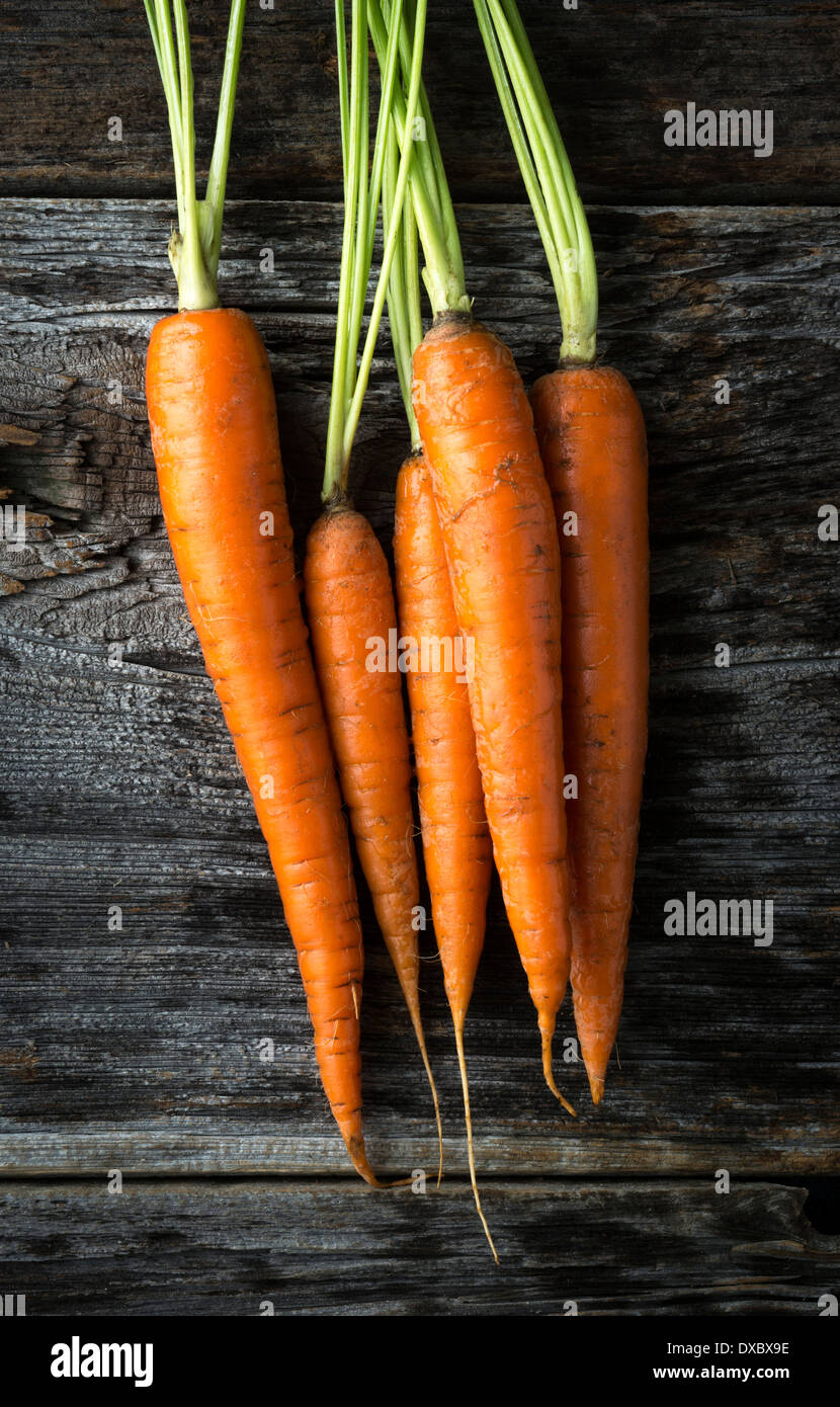Organic raw carrots of rustic wood Stock Photo - Alamy