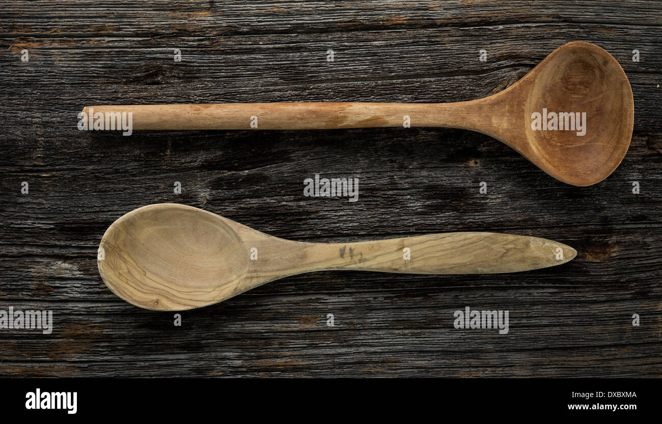 Two old wooden spoons set on rustic wood Stock Photo - Alamy