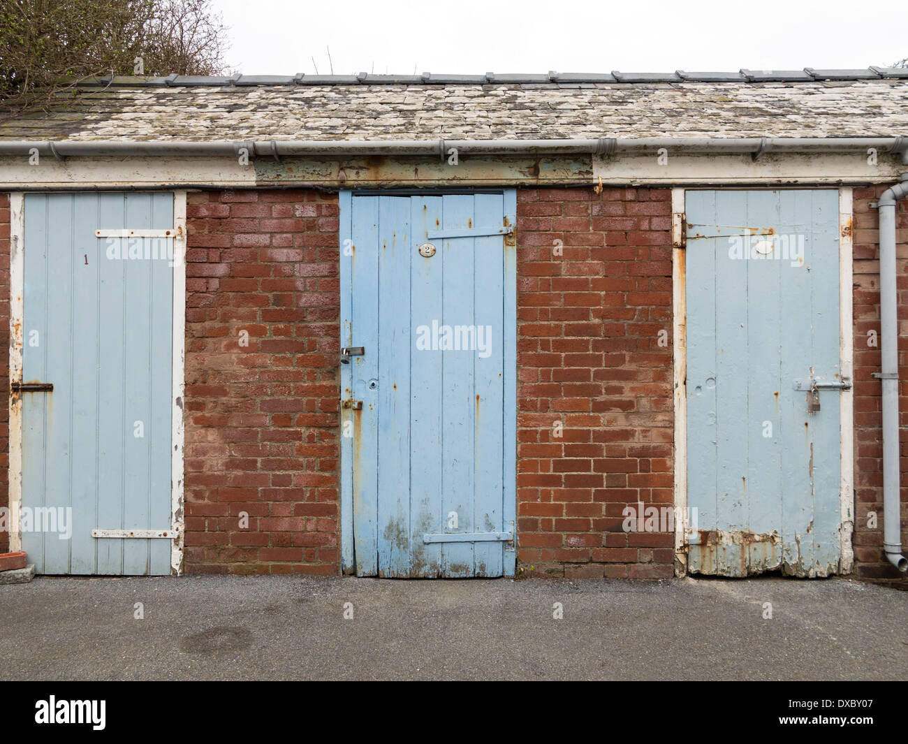 Three shed doors, blue Stock Photo - Alamy