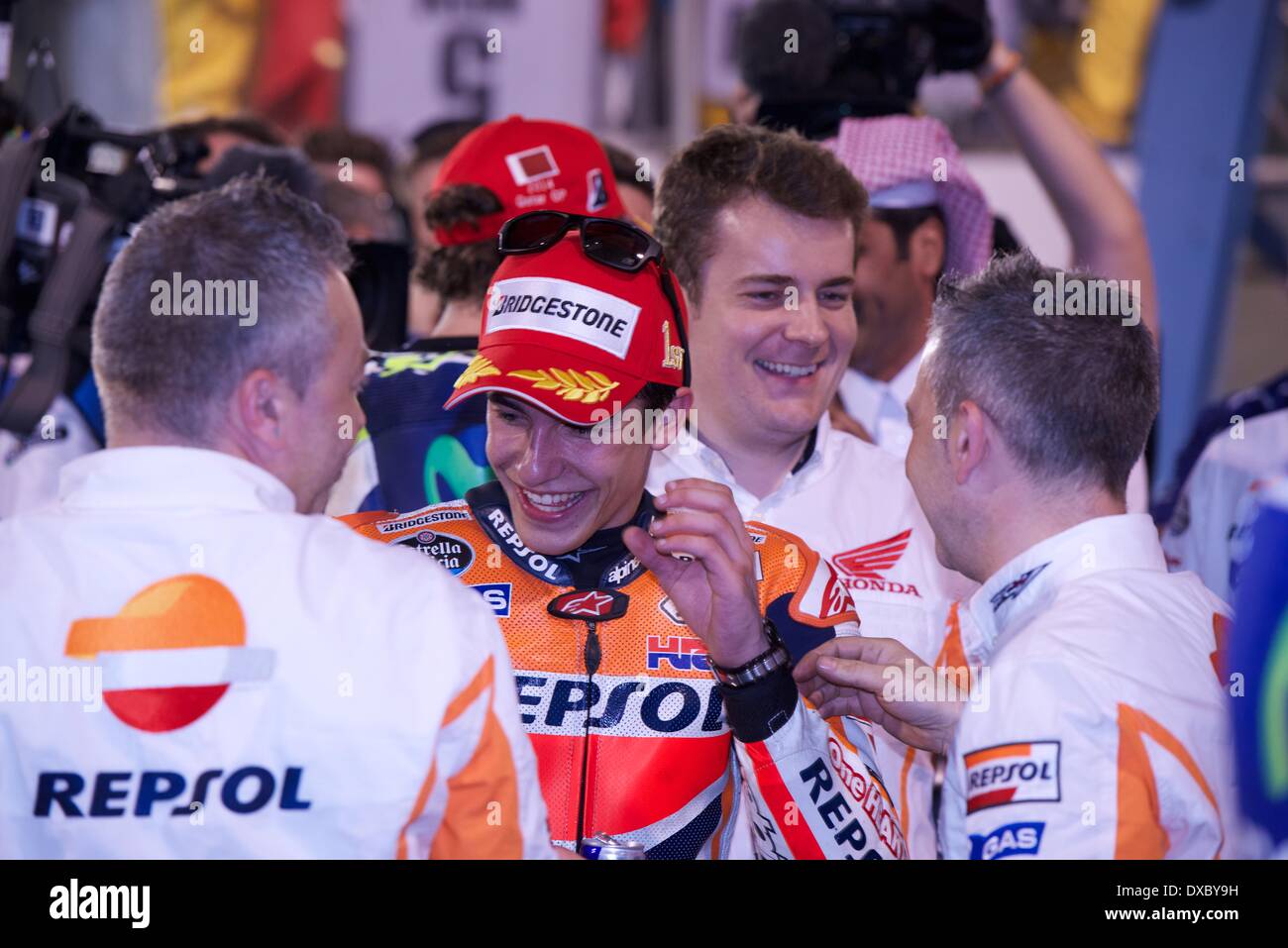 Qatar. 23rd Mar, 2014. Marc Marquez celebrates with his team after ...