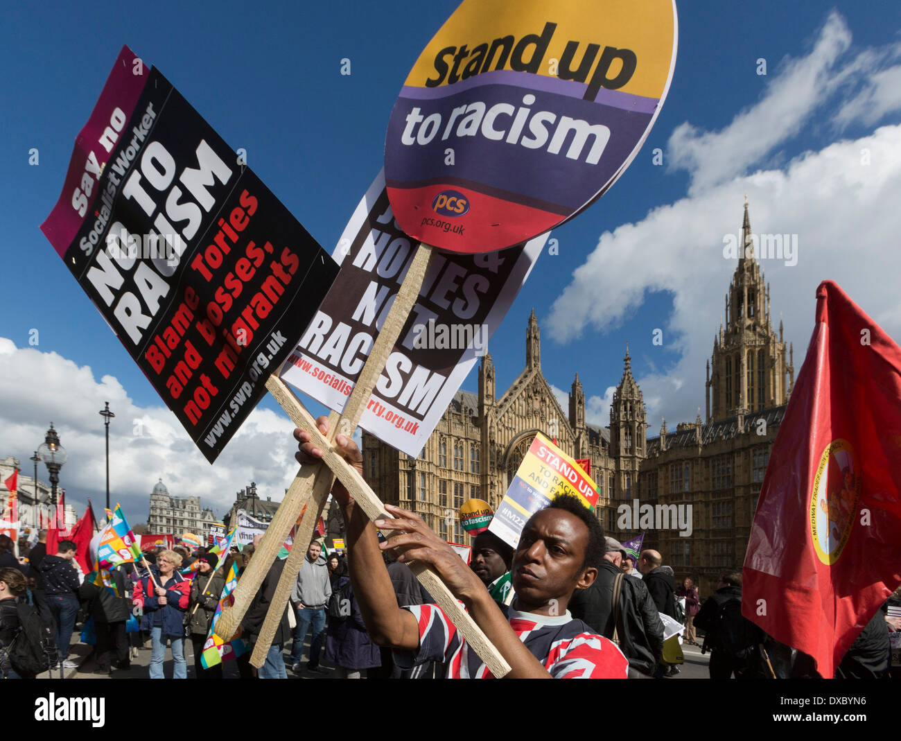 Man holds up placards at the London protest on the United Nations Anti ...