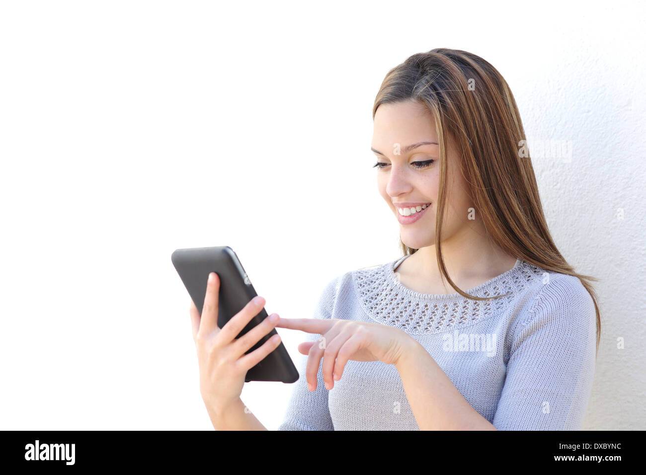 Happy beauty woman texting on a tablet on a white background Stock ...