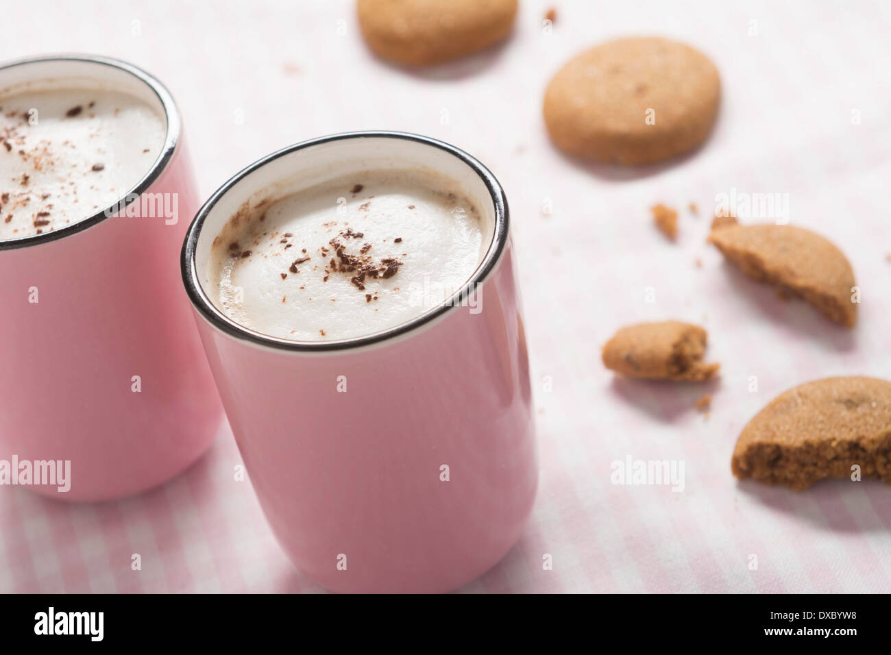 Cappuccino in pink cup with cocoa Stock Photo - Alamy