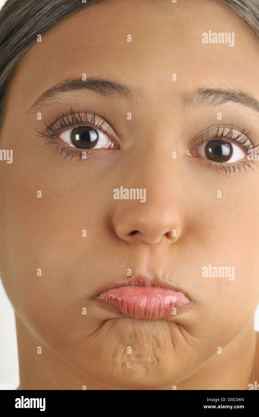 Female young adult face, pouting Stock Photo - Alamy