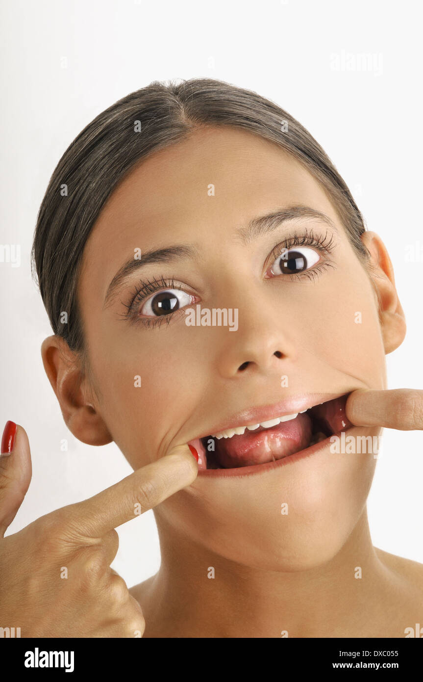Female young adult face, stretching mouth open Stock Photo - Alamy