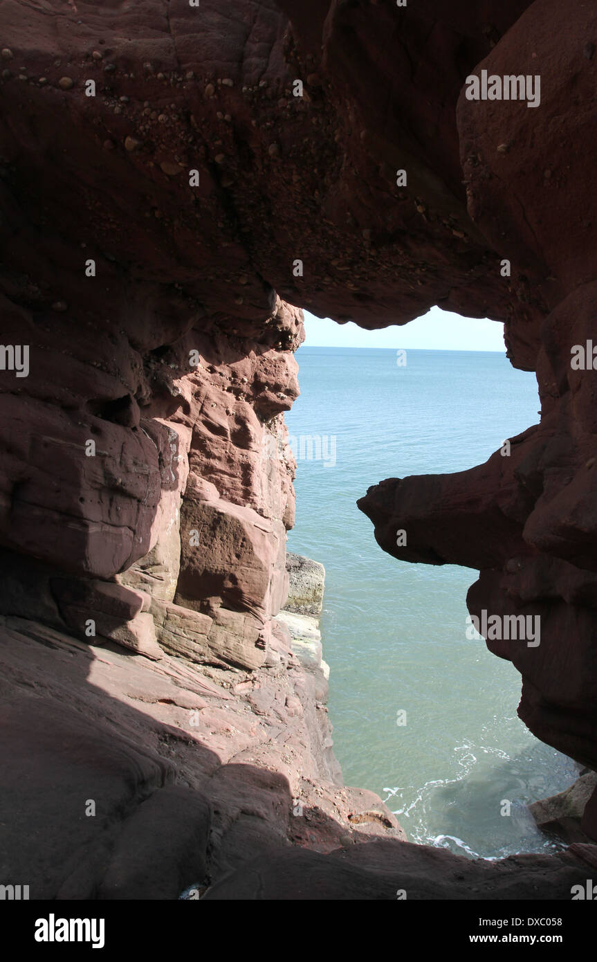 Needle E'e rock arch in red sandstone Seaton Cliffs Angus Scotland ...
