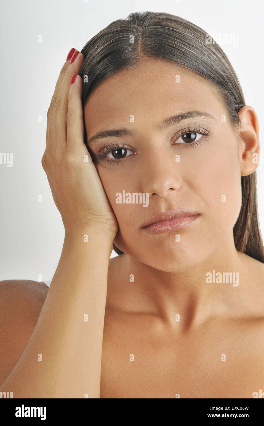Female young adult, hand holding head Stock Photo - Alamy