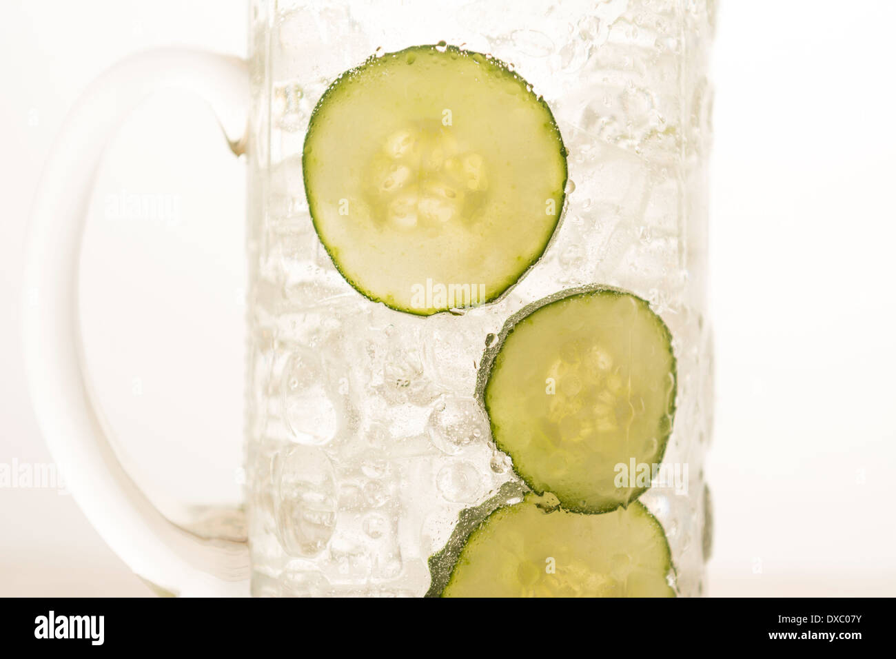 Cucumbers in cold water for refreshing summer drink Stock Photo - Alamy