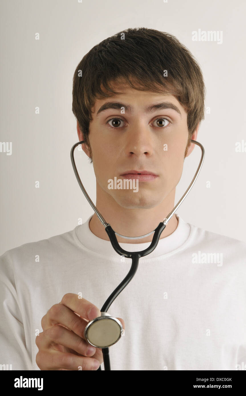 Young male adult with stethoscope Stock Photo - Alamy
