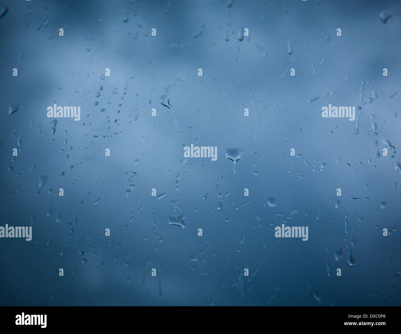 Rain drops on window across clouds Stock Photo - Alamy