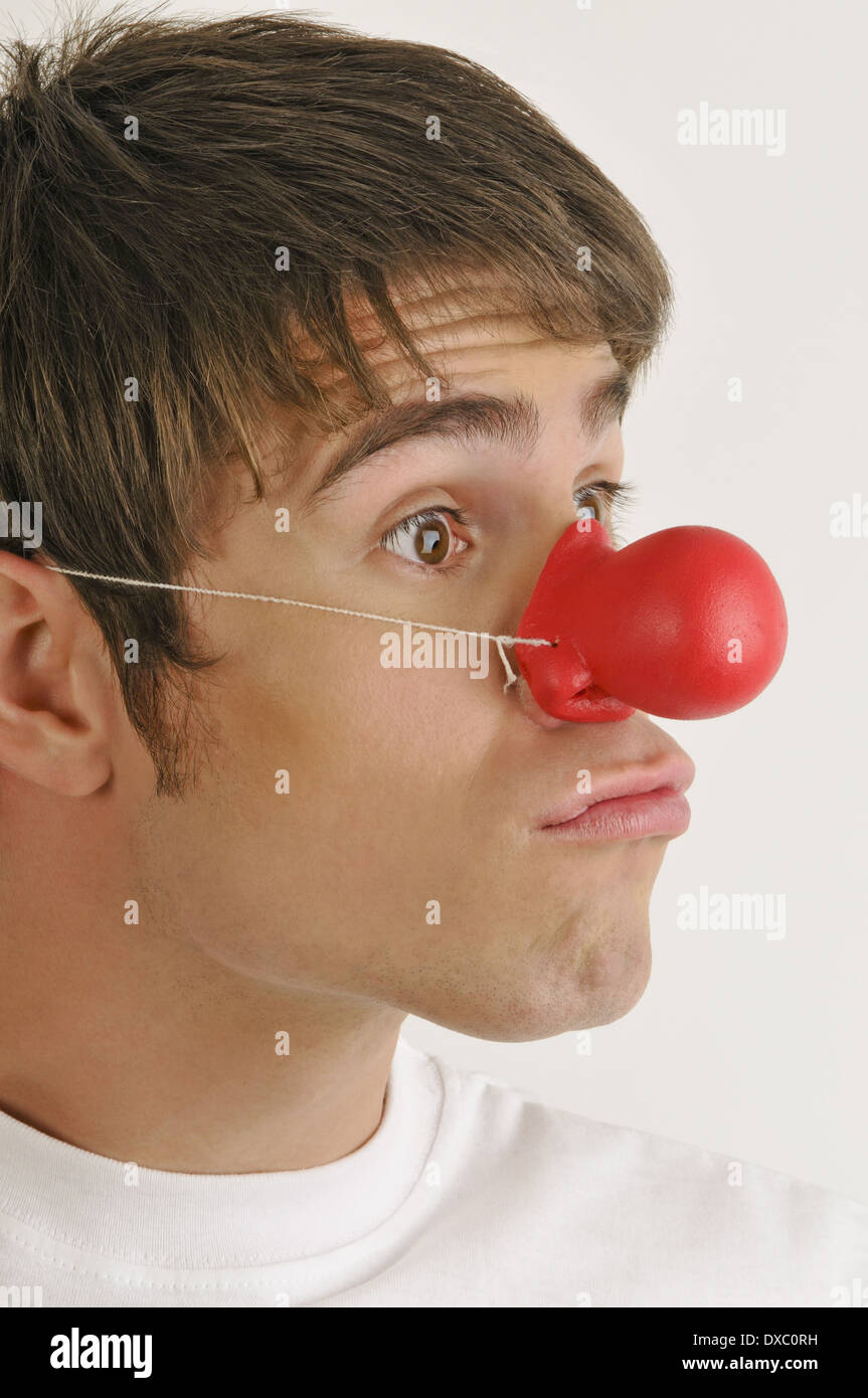 Young male adult with false nose Stock Photo - Alamy