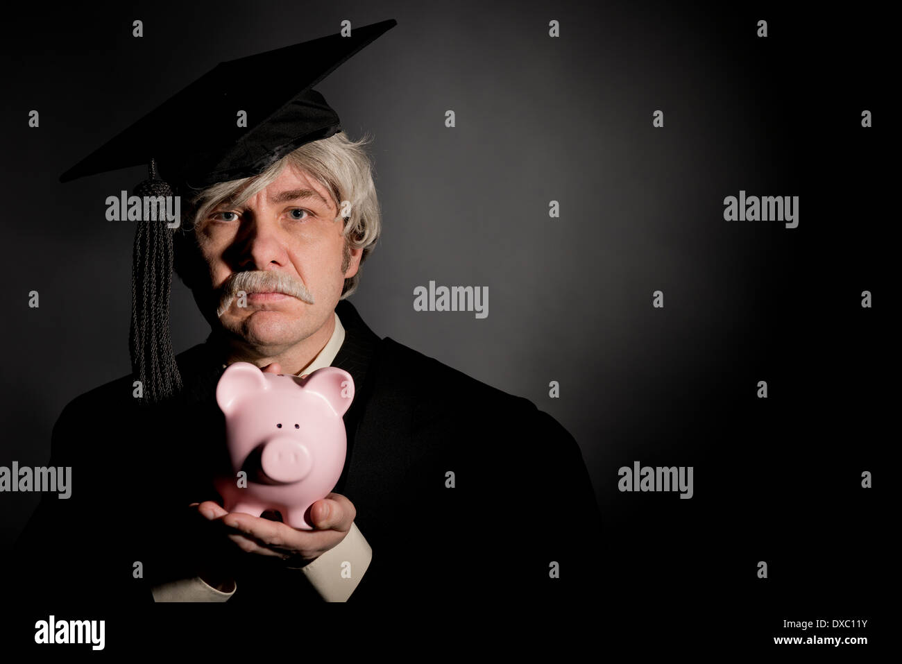 Education Fees - Grey haired, old style British headmaster holding a ...