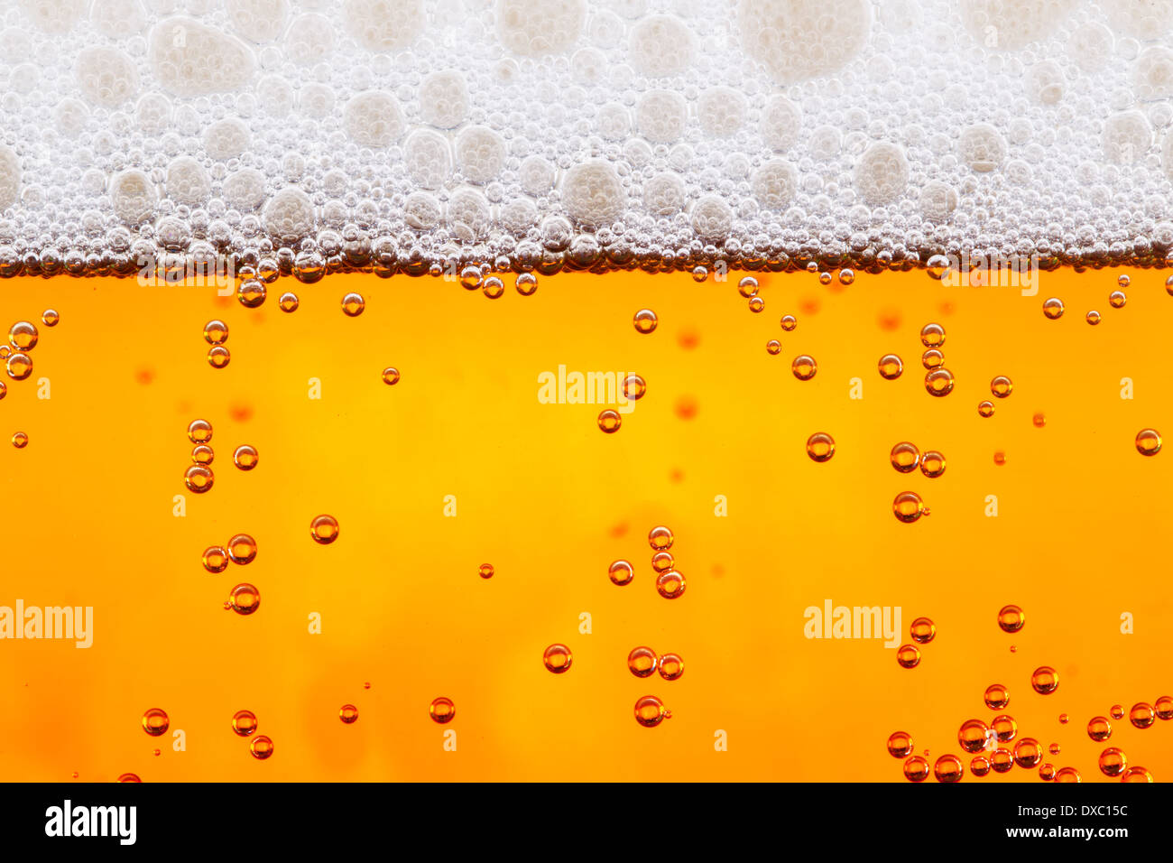 fresh beer with bubbles close up background Stock Photo - Alamy