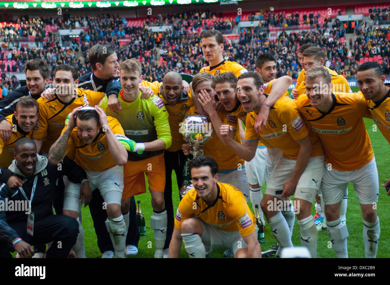 Cambridge United FC players celebrating with the FA Trophy after ...