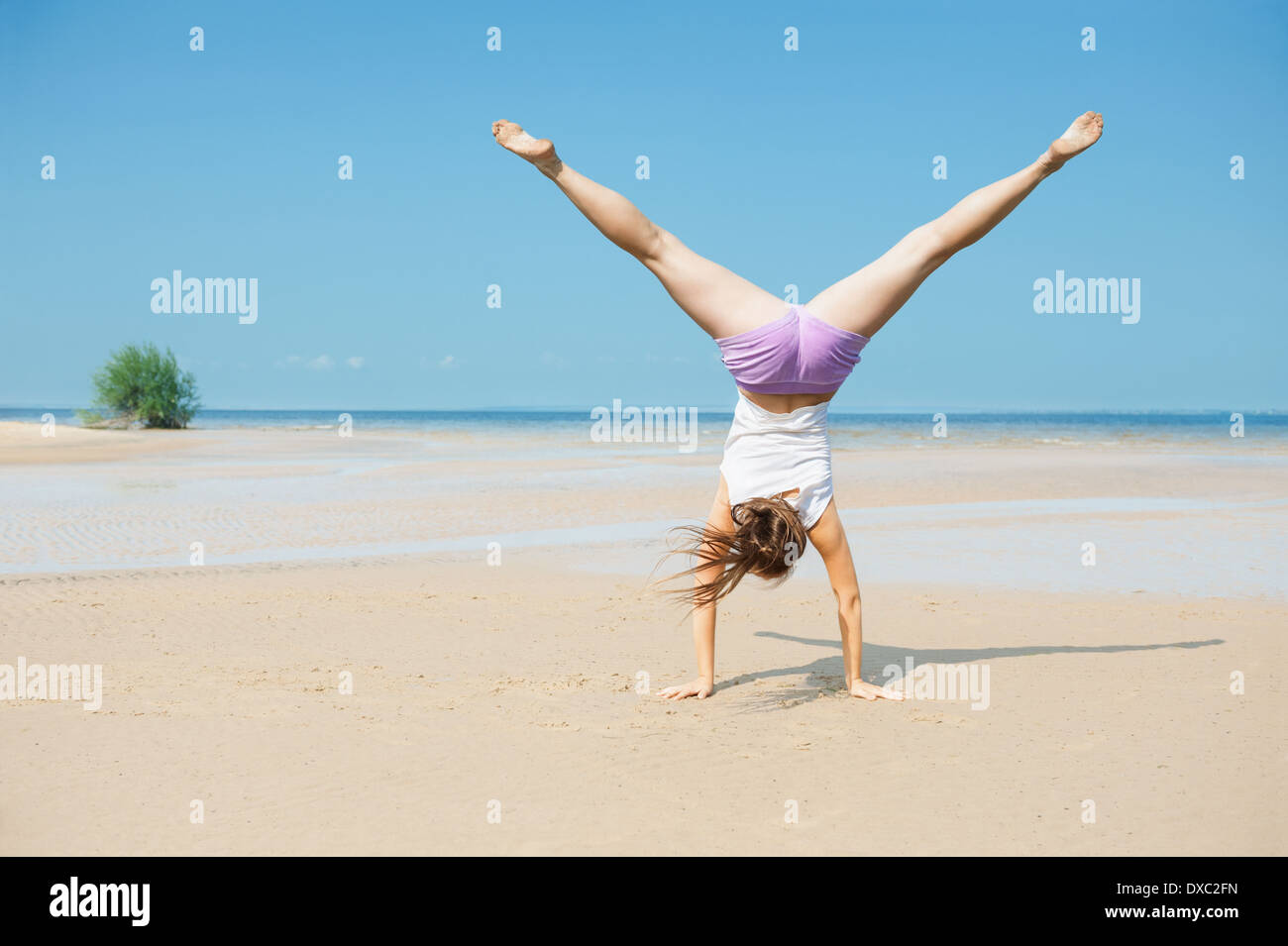 Woman Handstand Beach Sand High Resolution Stock Photography and Images ...