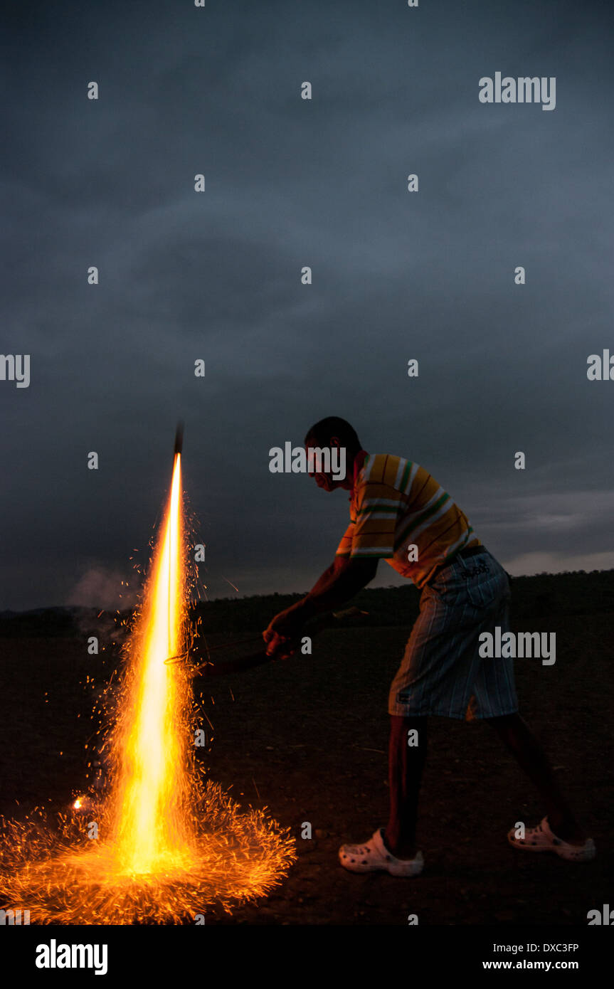 Man lighting fireworks Stock Photo - Alamy