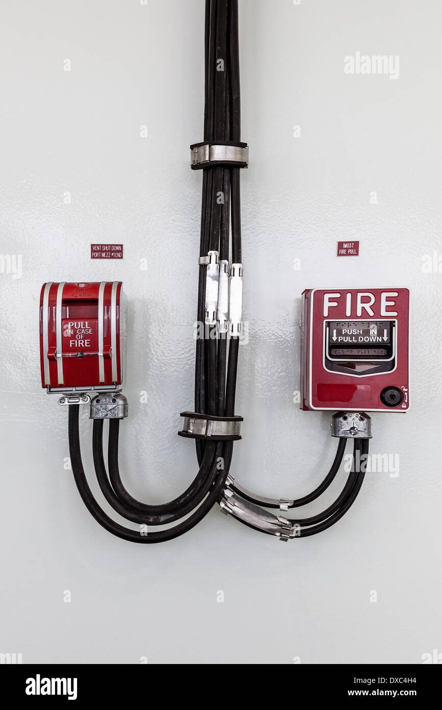 Two fire alarm levers next to each other on a white wall, stock photo ...