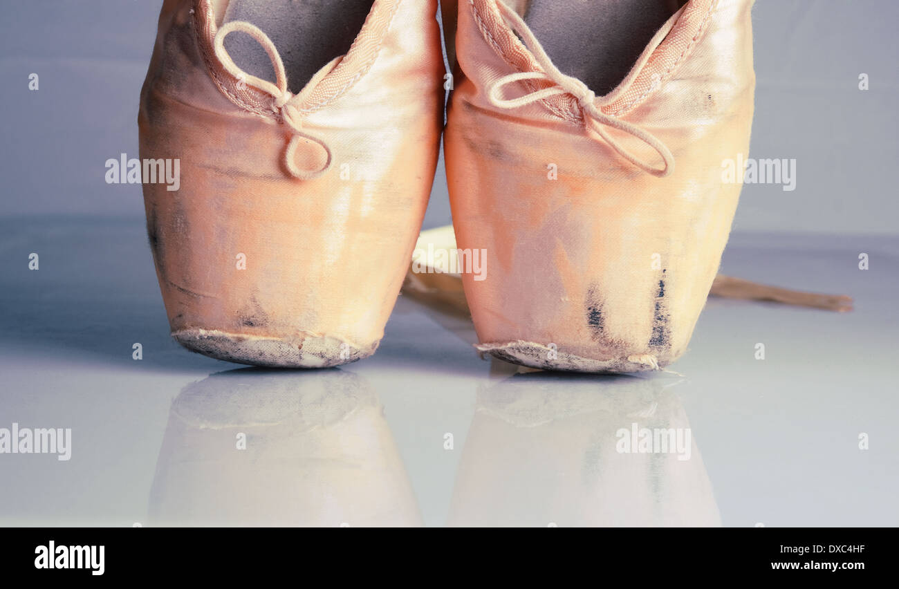 Old used pink ballet pointe shoes with reflection Stock Photo - Alamy