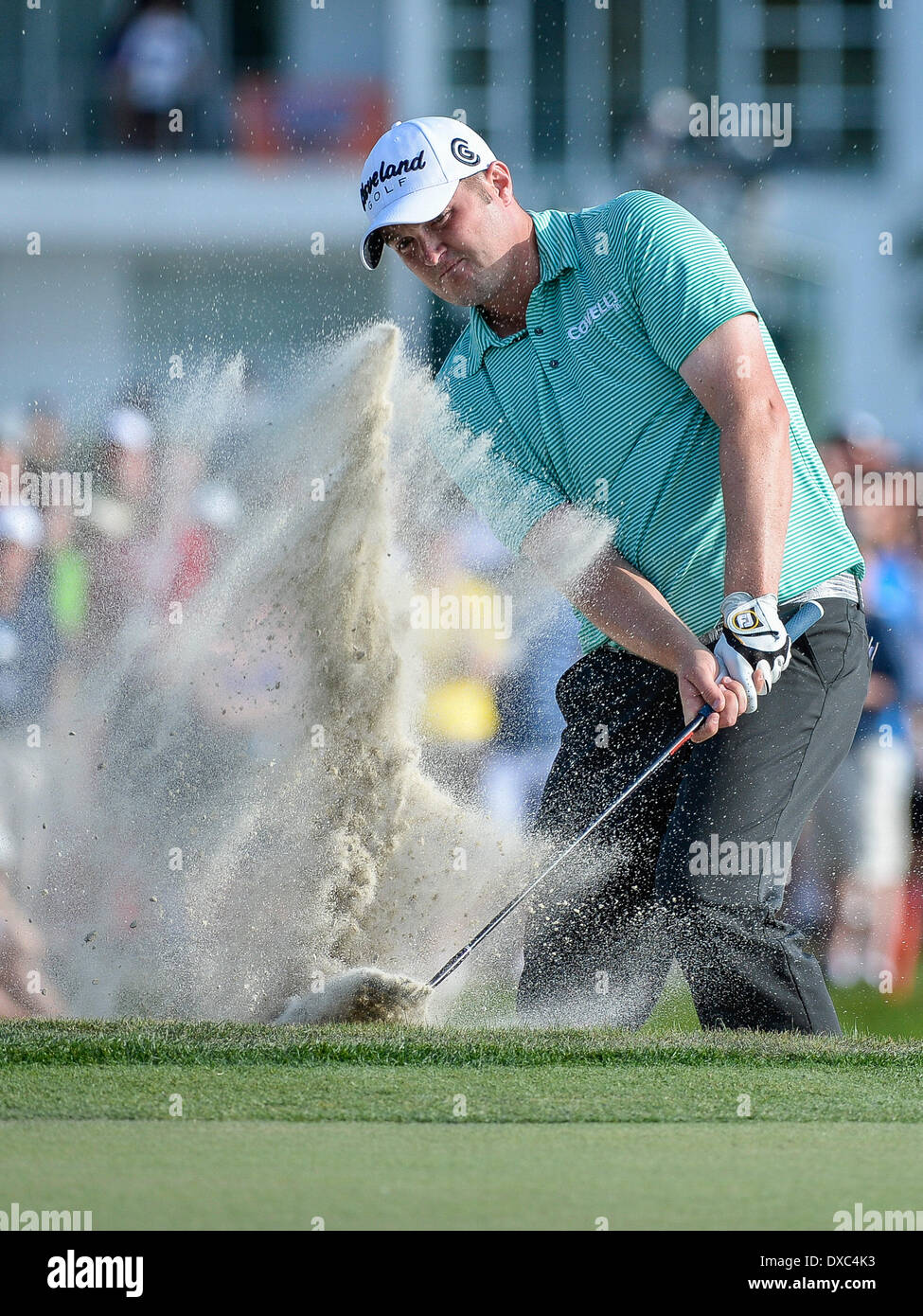 Orlando, Florida, USA. March 23, 2014. Jason Kokrak from the green side ...