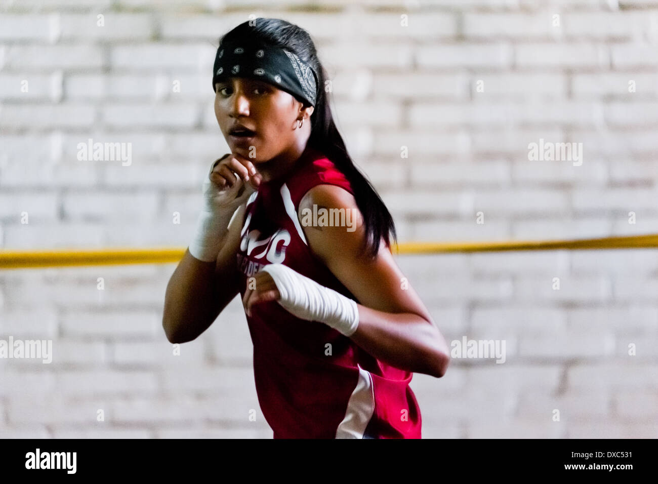 Geraldin Hamann, a young Colombian boxer, practices shadowboxing while ...