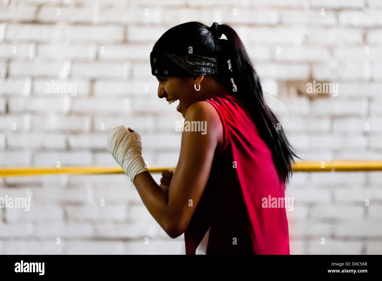 Geraldin Hamann, a young Colombian boxer, practices shadowboxing while ...