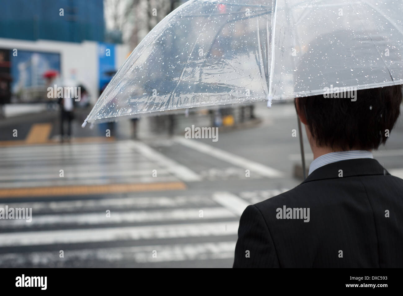 Japanese businessman under the rain in Aoyama, Tokyo, Japan Stock Photo ...