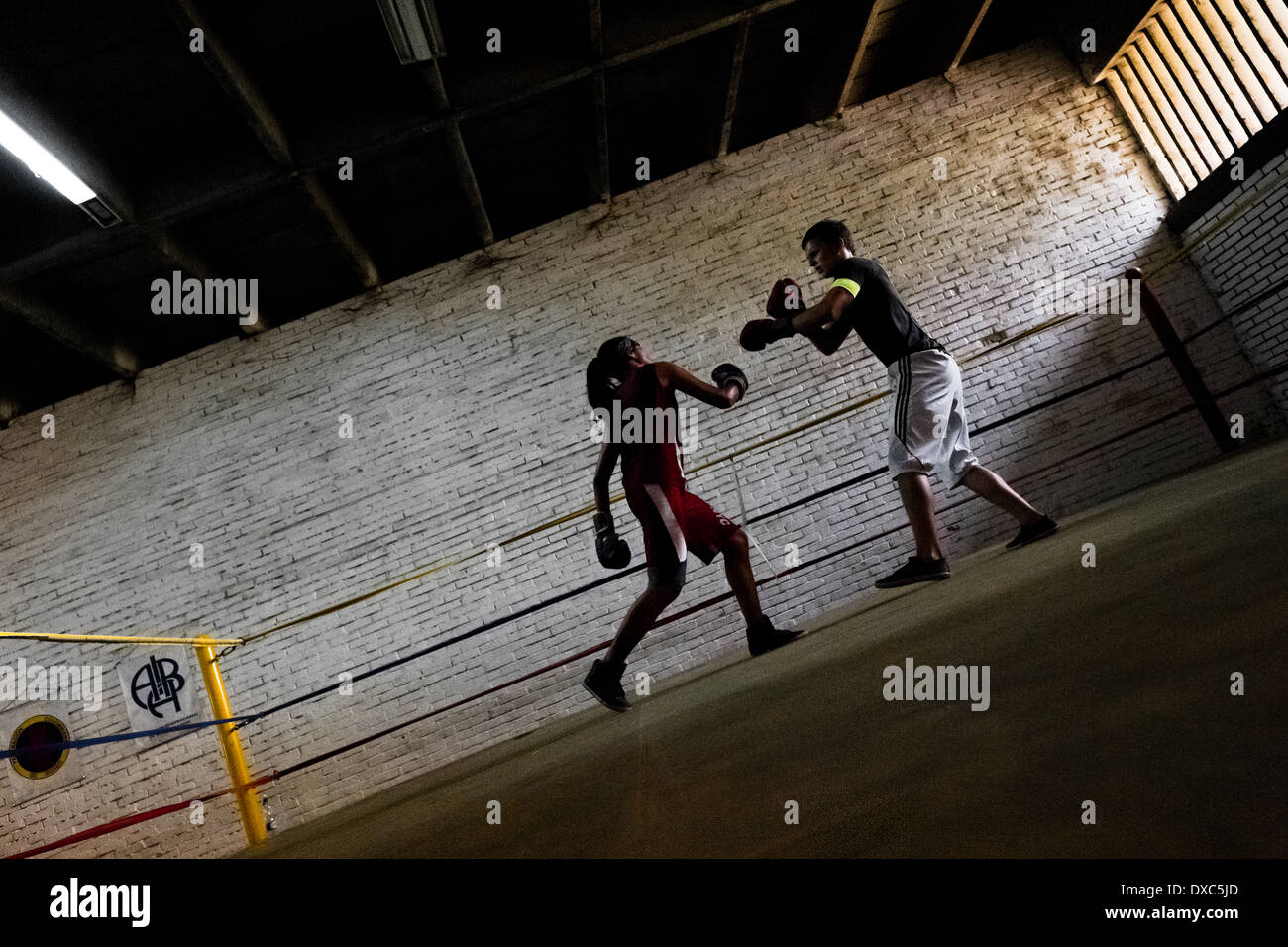 A young Colombian boxer, is seen during a boxing sparring workout with ...