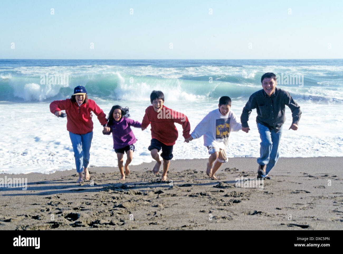 Young chinese family running in hi-res stock photography and images - Alamy