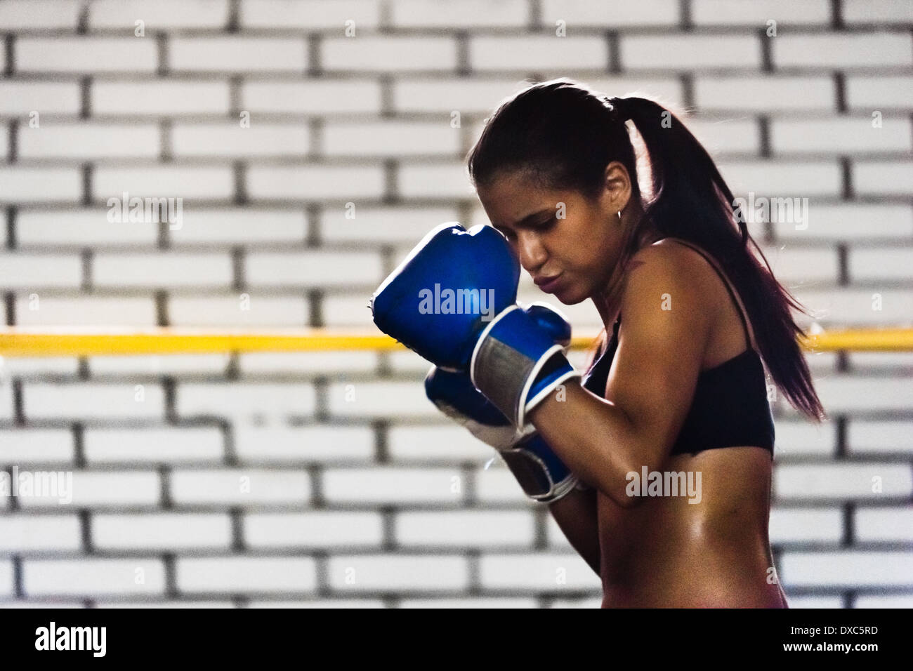 Geraldin Hamann, a young Colombian boxer, practices defense while ...