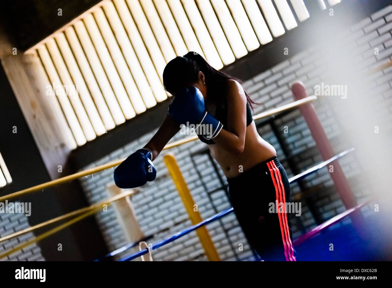 Geraldin Hamann, a young Colombian boxer, practices shadowboxing while ...