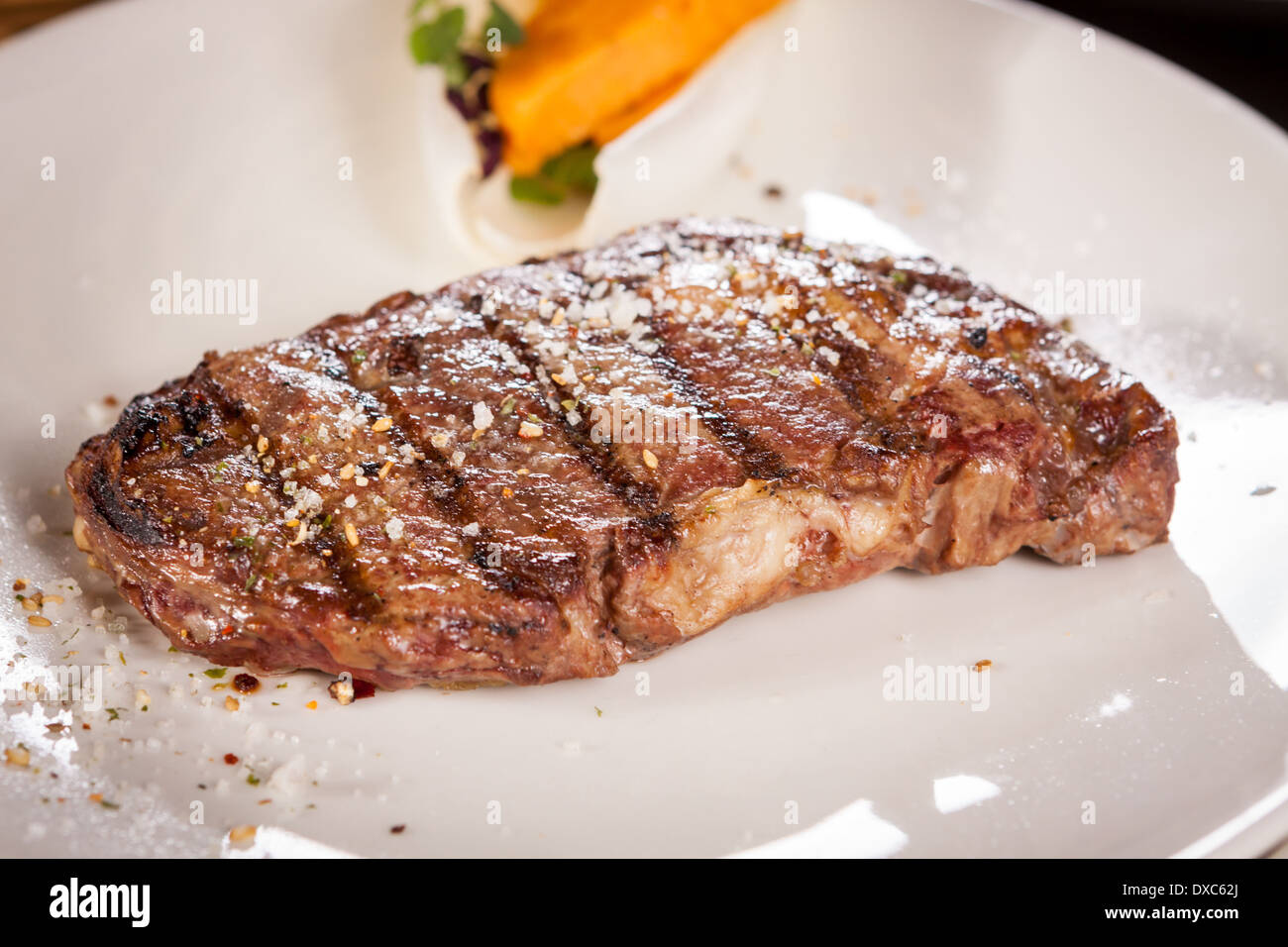 Delicious trimmed lean portion of thick grilled beef steak with ...