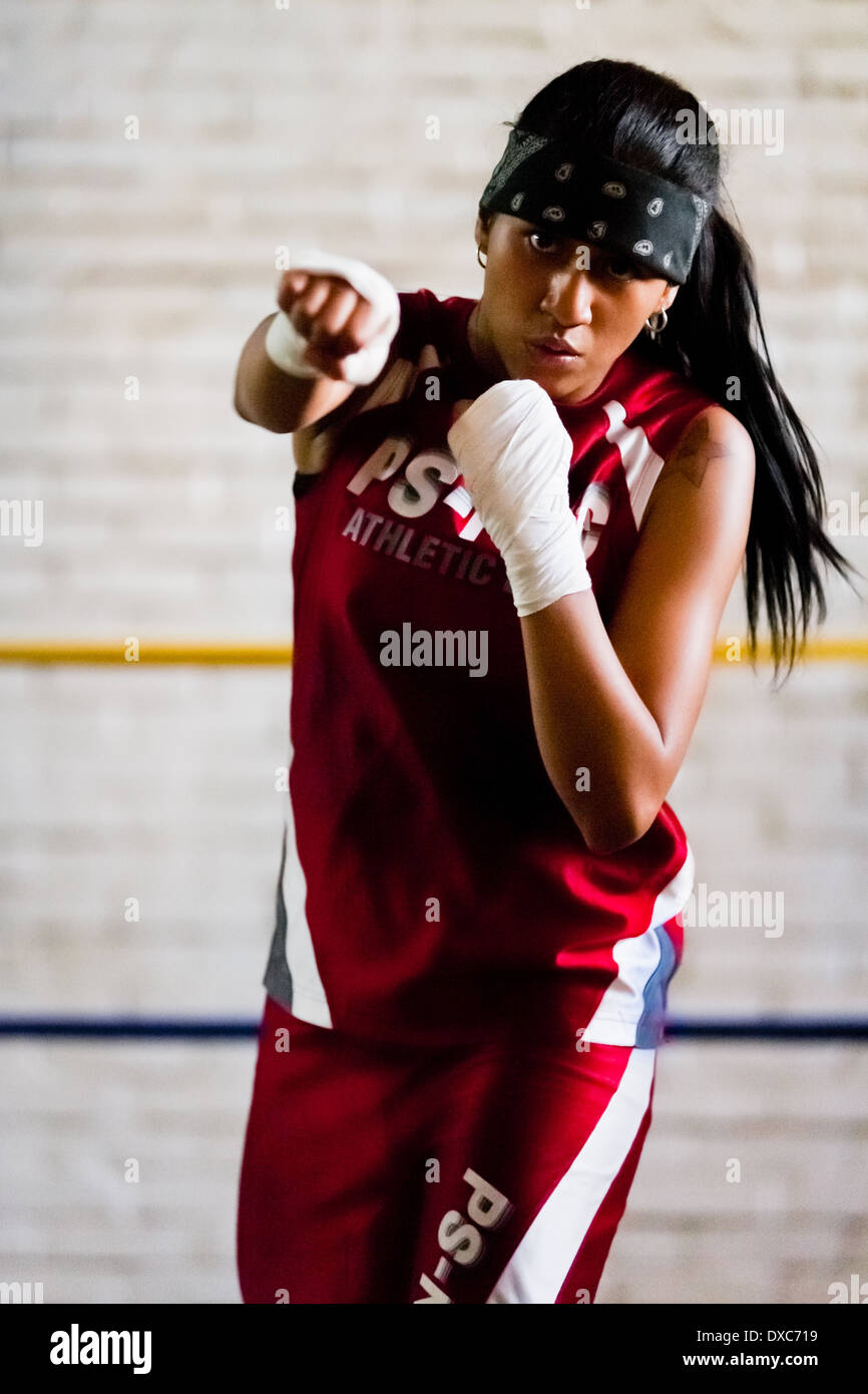 Geraldin Hamann, a young Colombian boxer, practices shadowboxing while ...