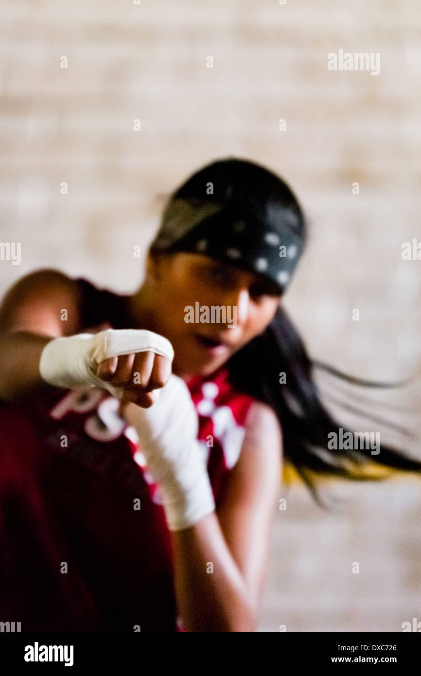 Geraldin Hamann, a young Colombian boxer, practices shadowboxing while ...