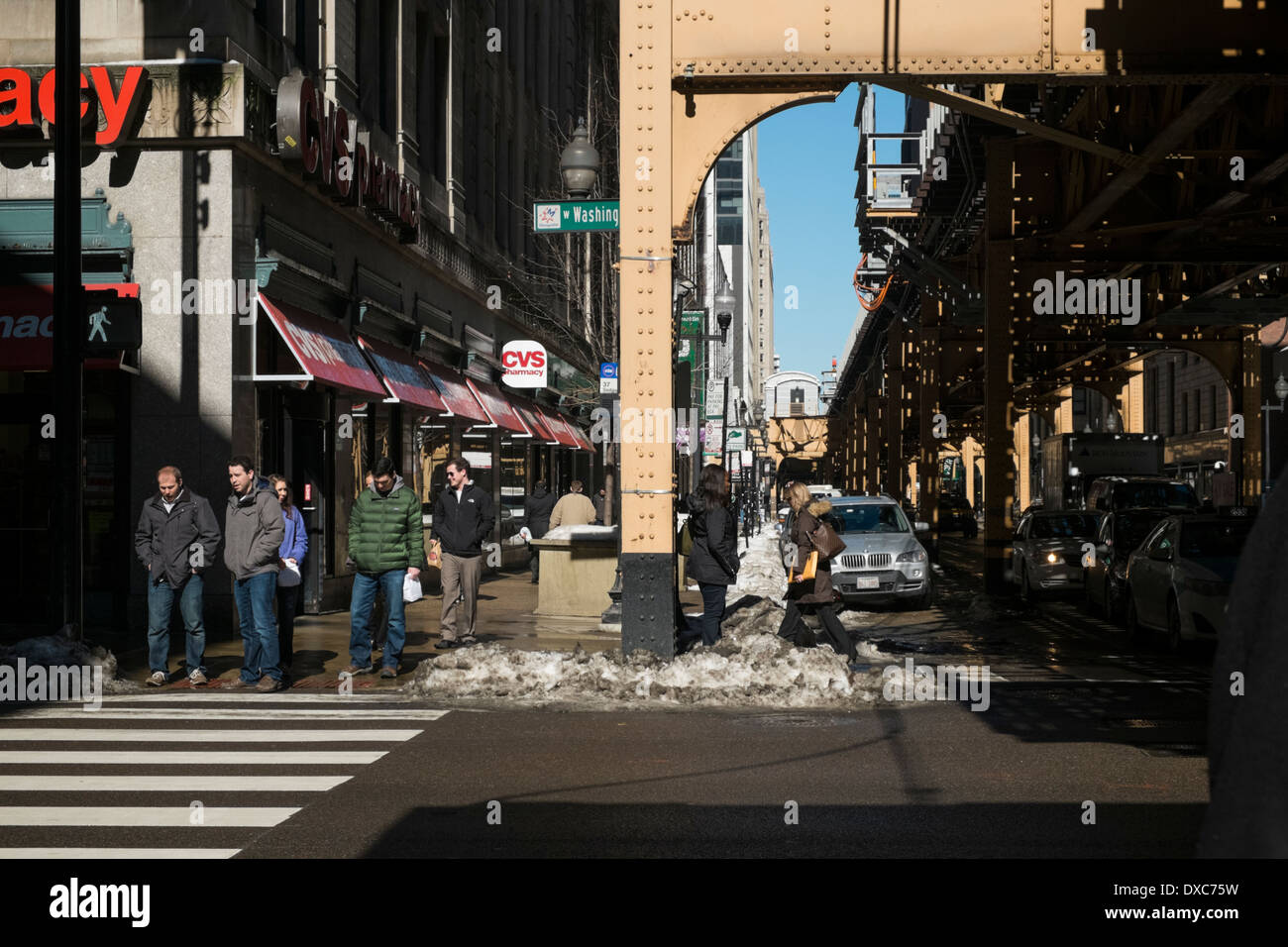 Pedestrians on Washington St near the El in the Loop Chicago Illinois ...
