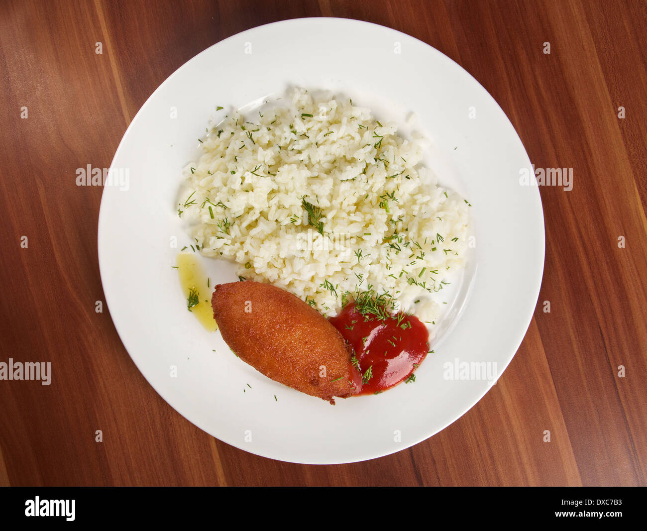 chicken kiev with rice Stock Photo - Alamy