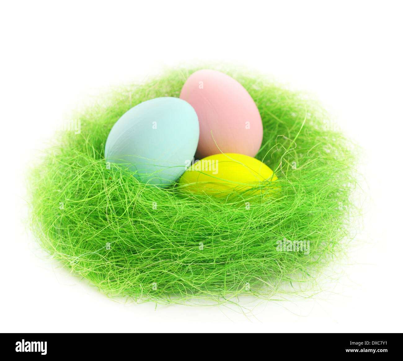 Easter eggs in hay nest isolated on white background Stock Photo - Alamy