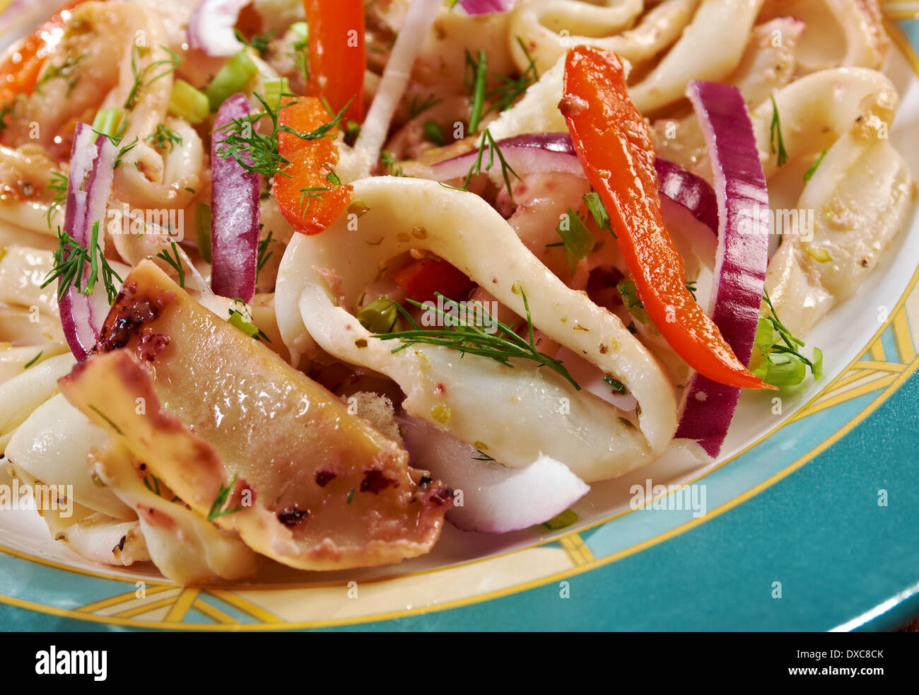 Calamari in padella. mediterranean cuisine.roasted squids with ...