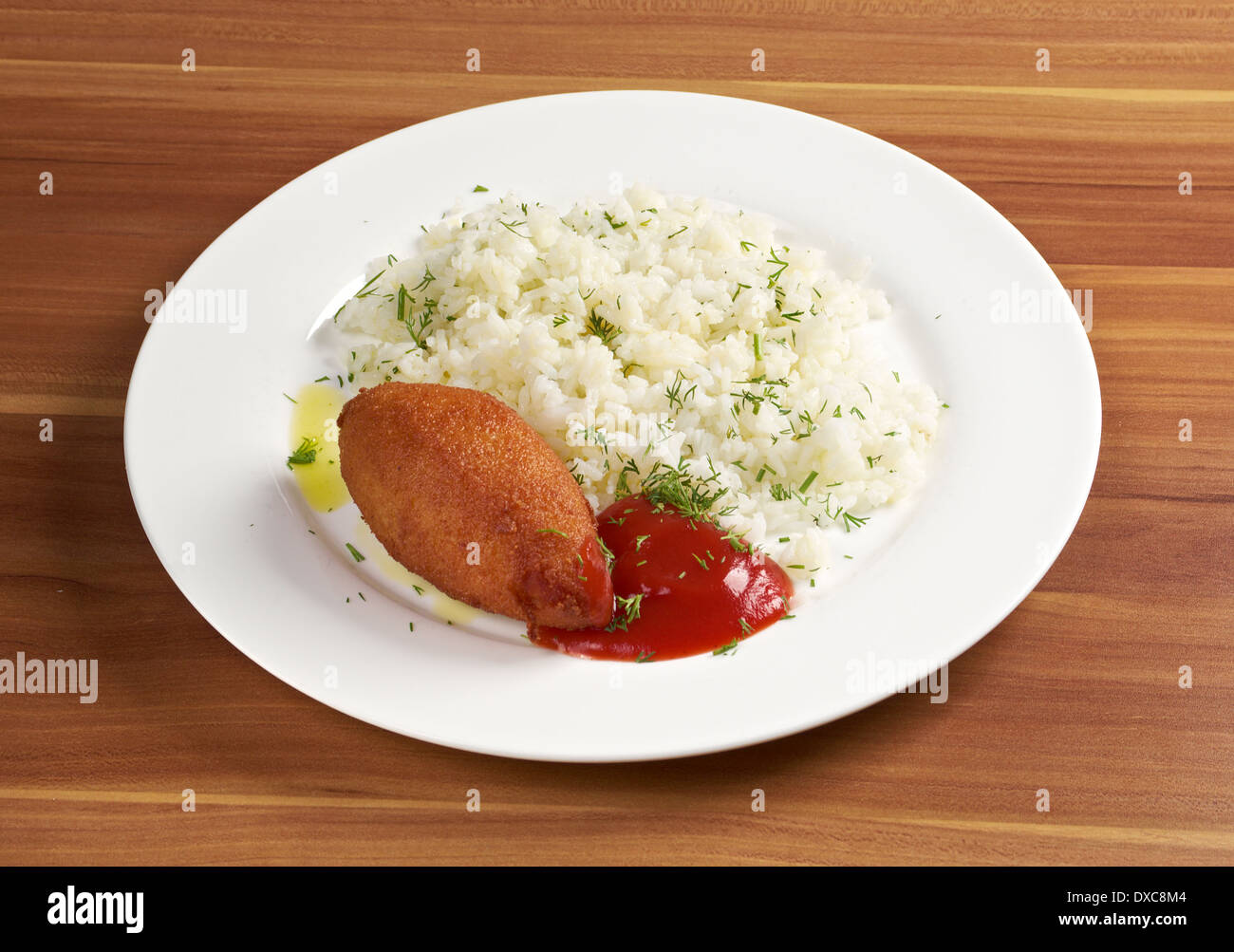 chicken kiev with rice Stock Photo - Alamy