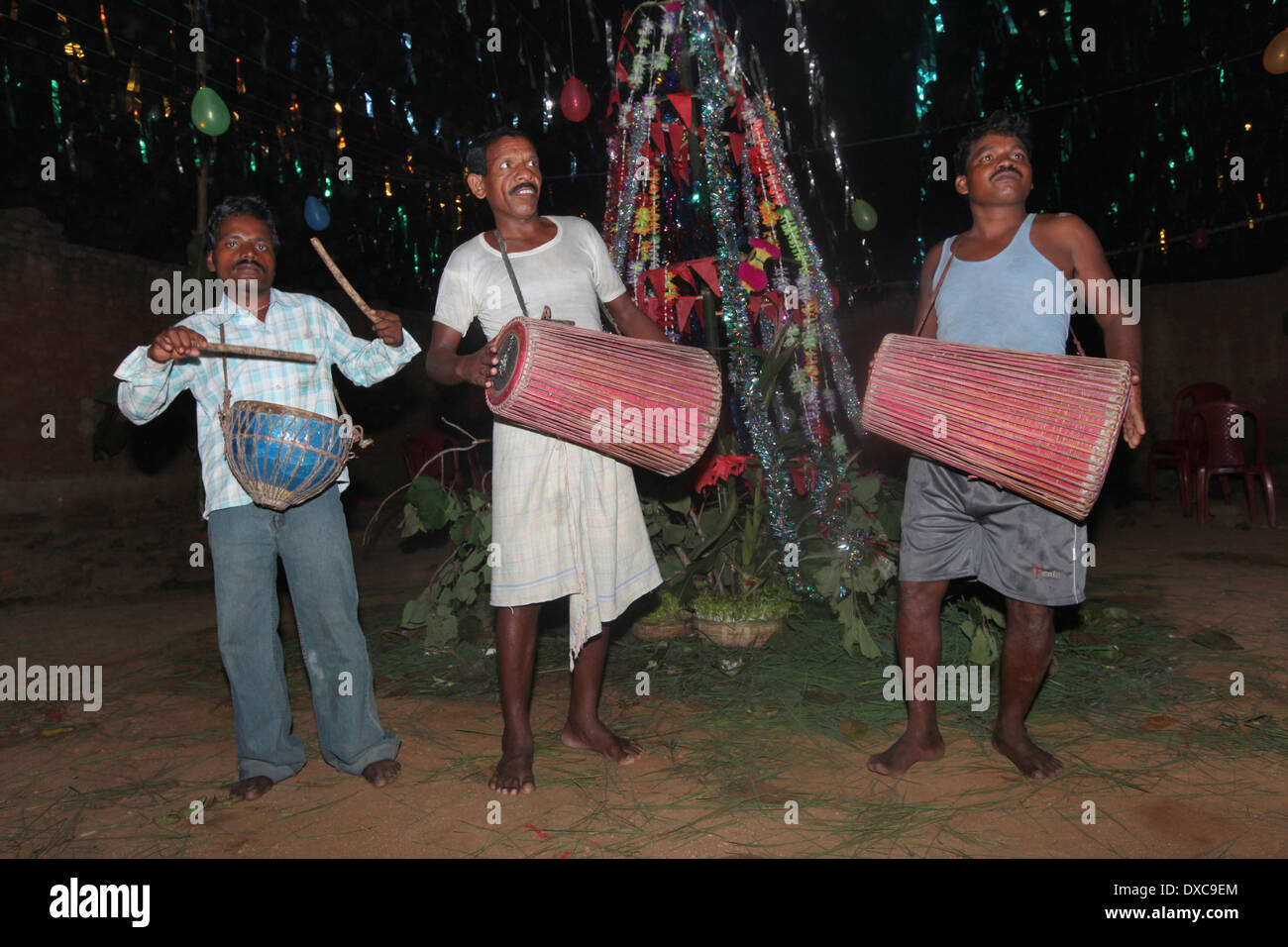 Tribal men playing musical instruments during Karma Puja festival ...