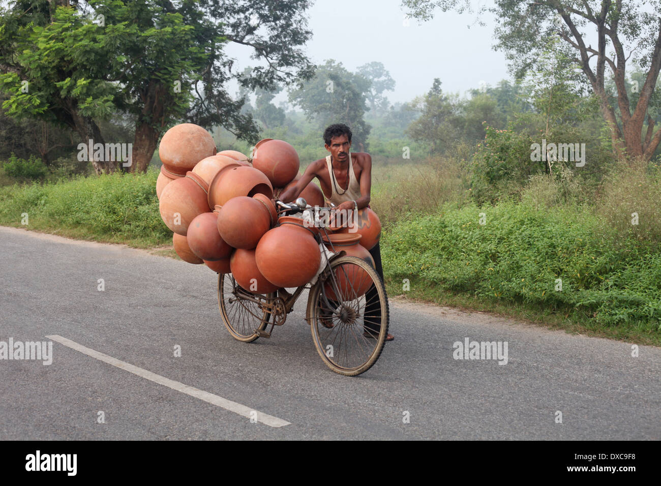 Man carrying pots hi-res stock photography and images - Alamy
