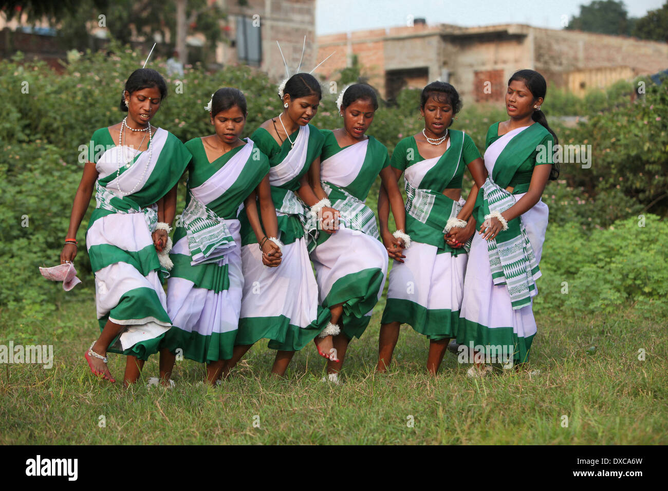 Tribal girls performing a typical tribal dance in traditional outfits ...